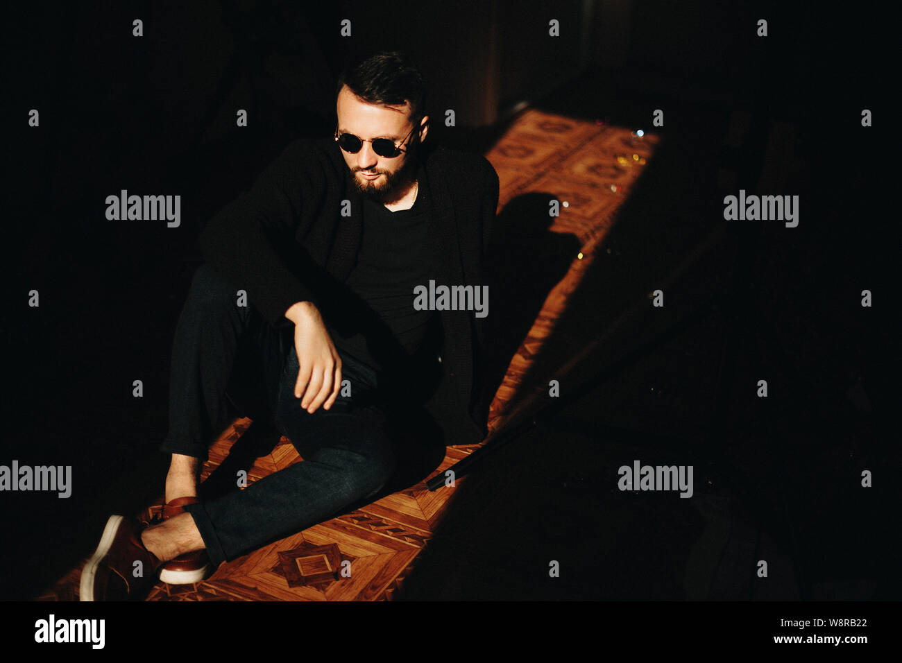 Man sitting from above shadow hi-res stock photography and images - Alamy