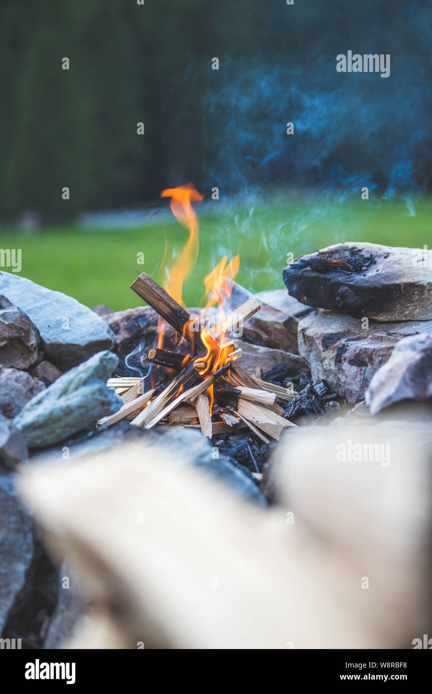 Making fire in the wood, camping outdoors Stock Photo - Alamy