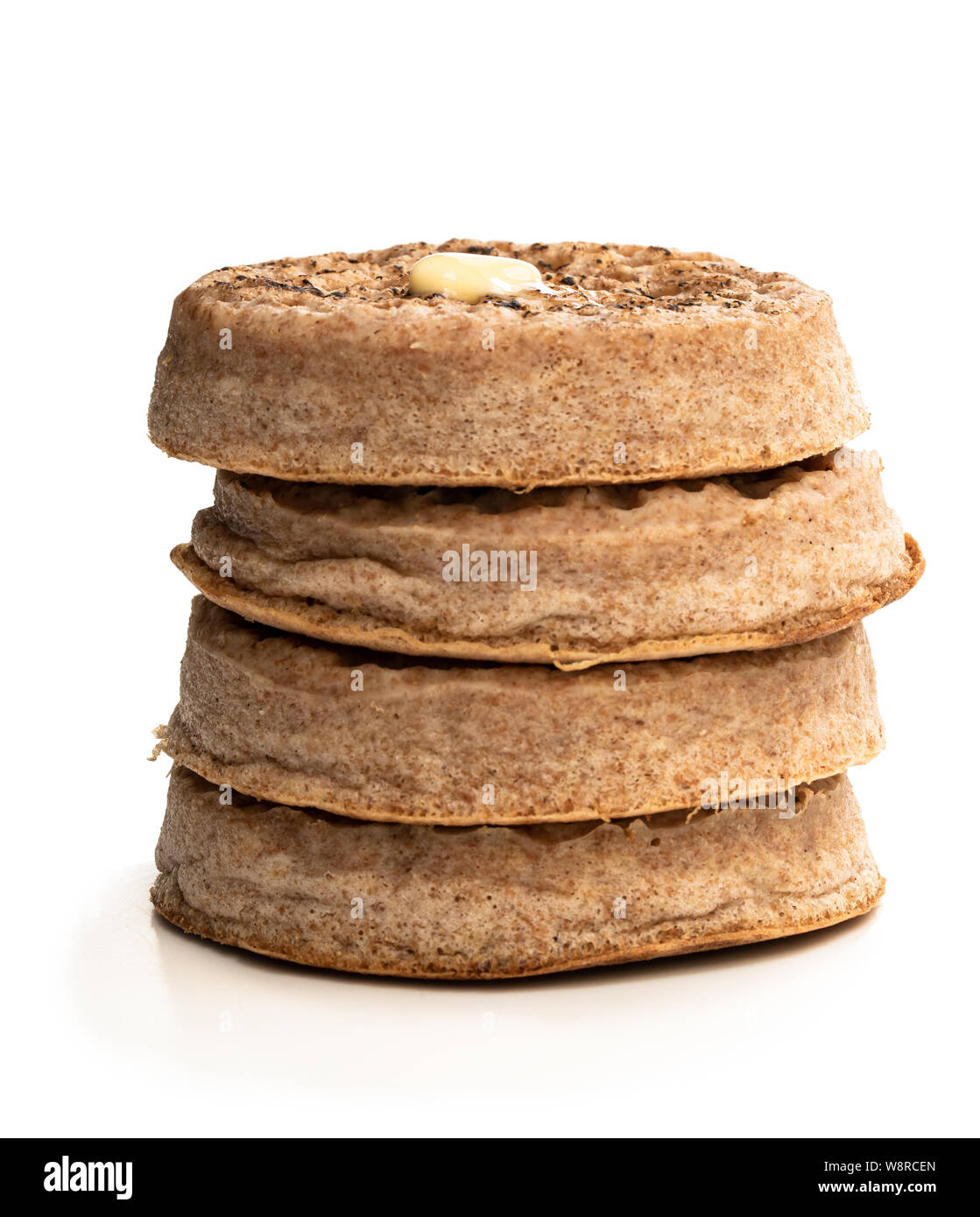 Stack of wholemeal crumpets isolated on white background Stock Photo ...