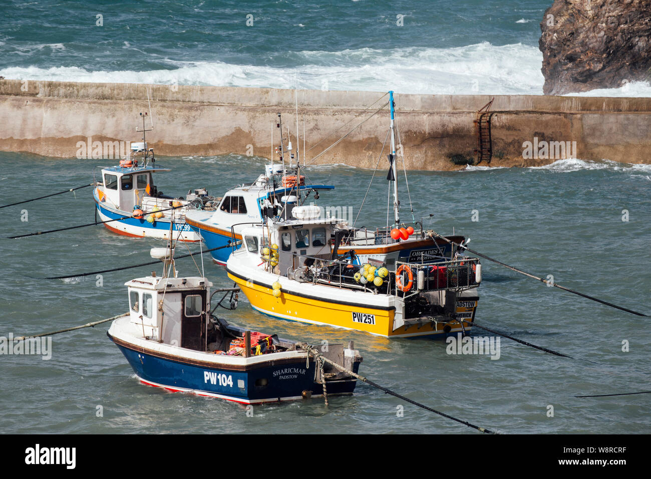 Fishing boats in the harbour in Port Isaac, Cornwall Stock Photo - Alamy