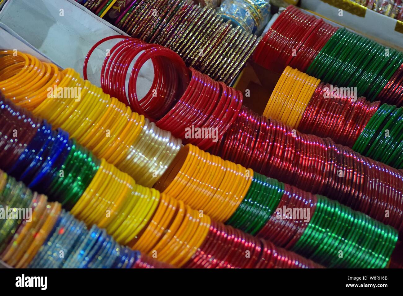 Lined up colorful Bangles at Indian road side shop in Varanasi, India ...