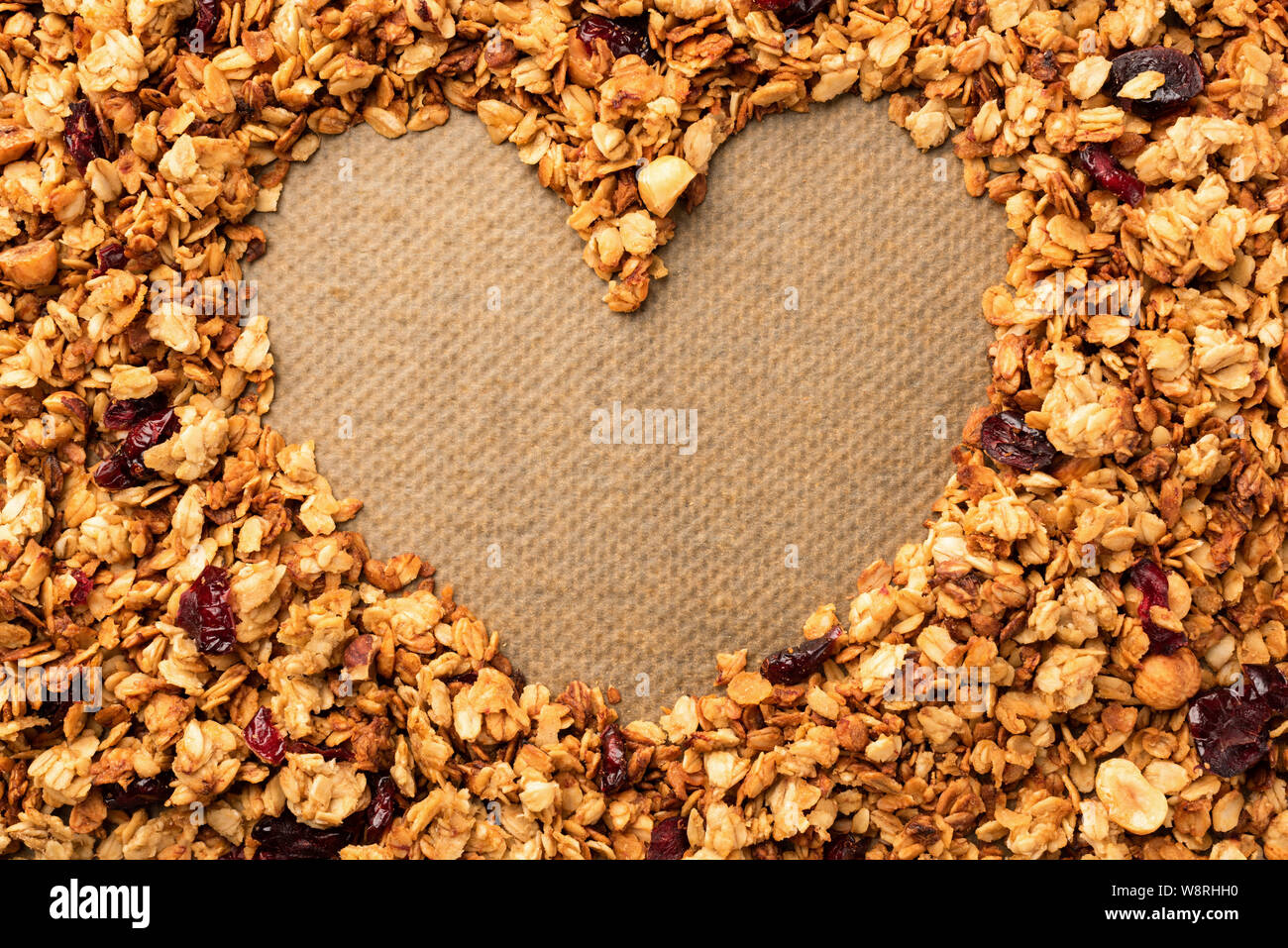 Frame of tasty homemade granola with heart shape copy space. Breakfast ...