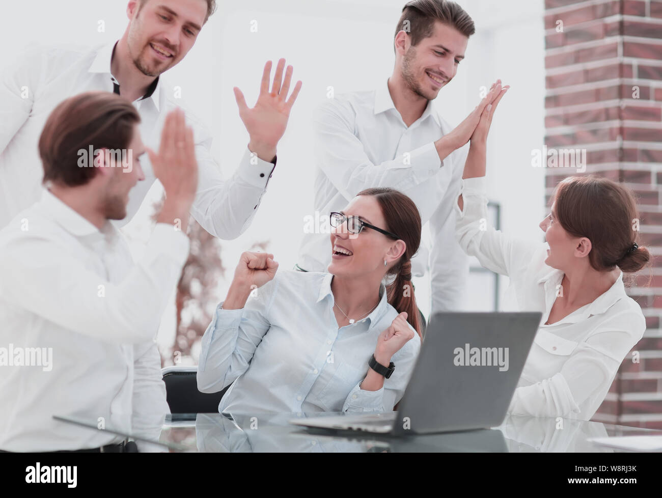 happy business team showing their success Stock Photo - Alamy