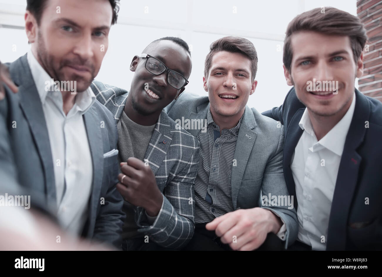 Smiling employees company folded hi-res stock photography and images ...