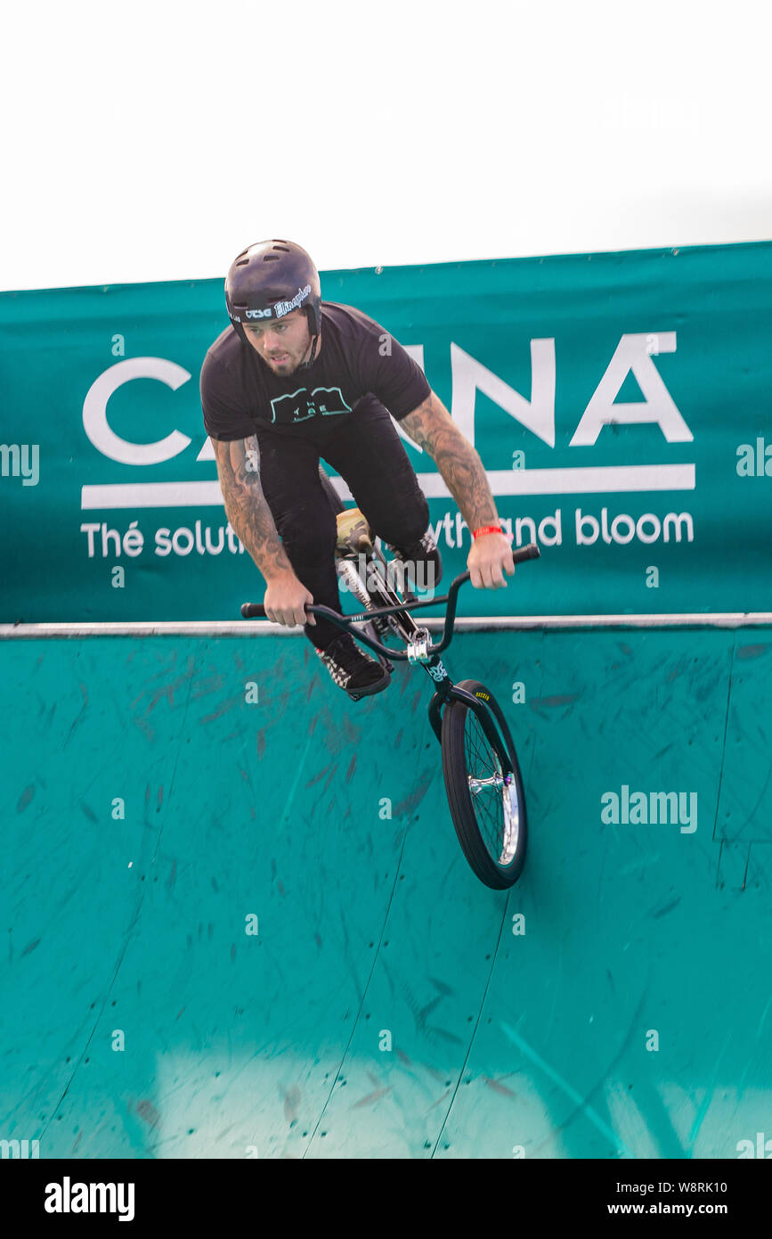 BMX tricks on a half pipe Stock Photo - Alamy