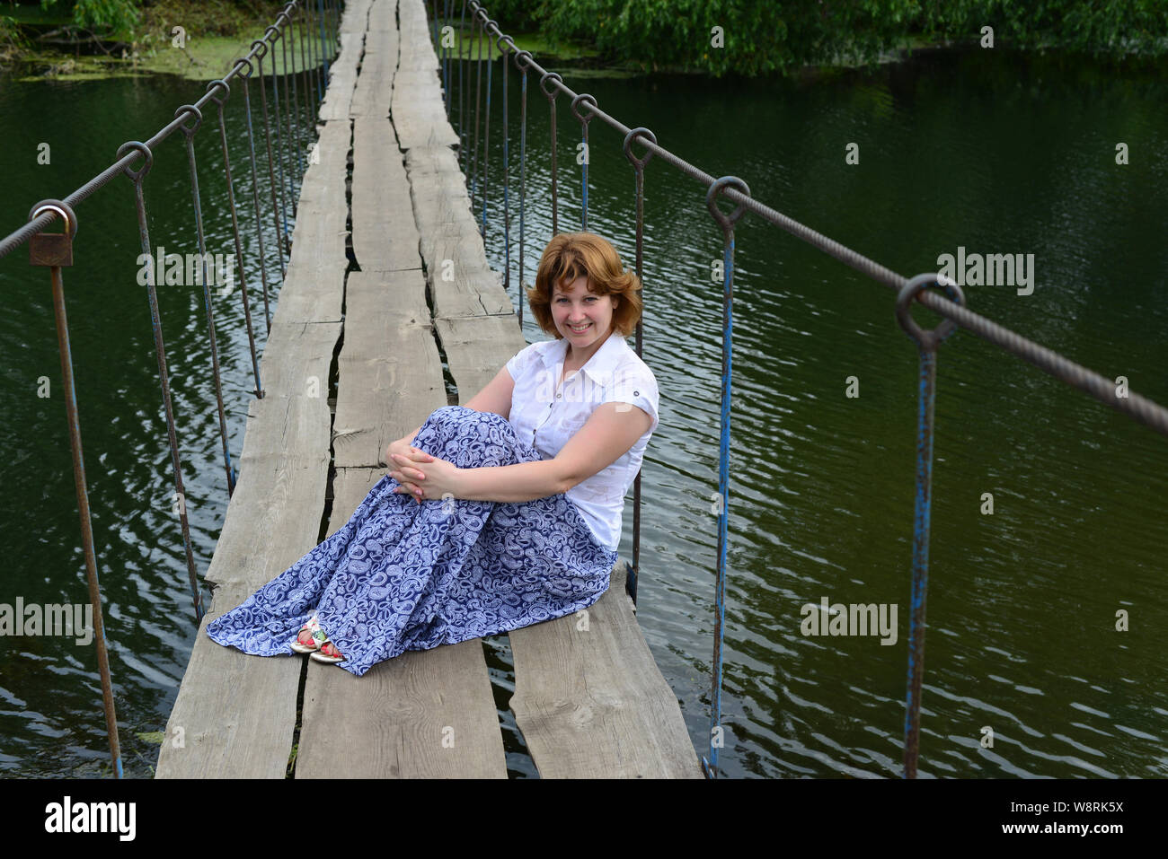Woman on bridge over river hi-res stock photography and images - Alamy