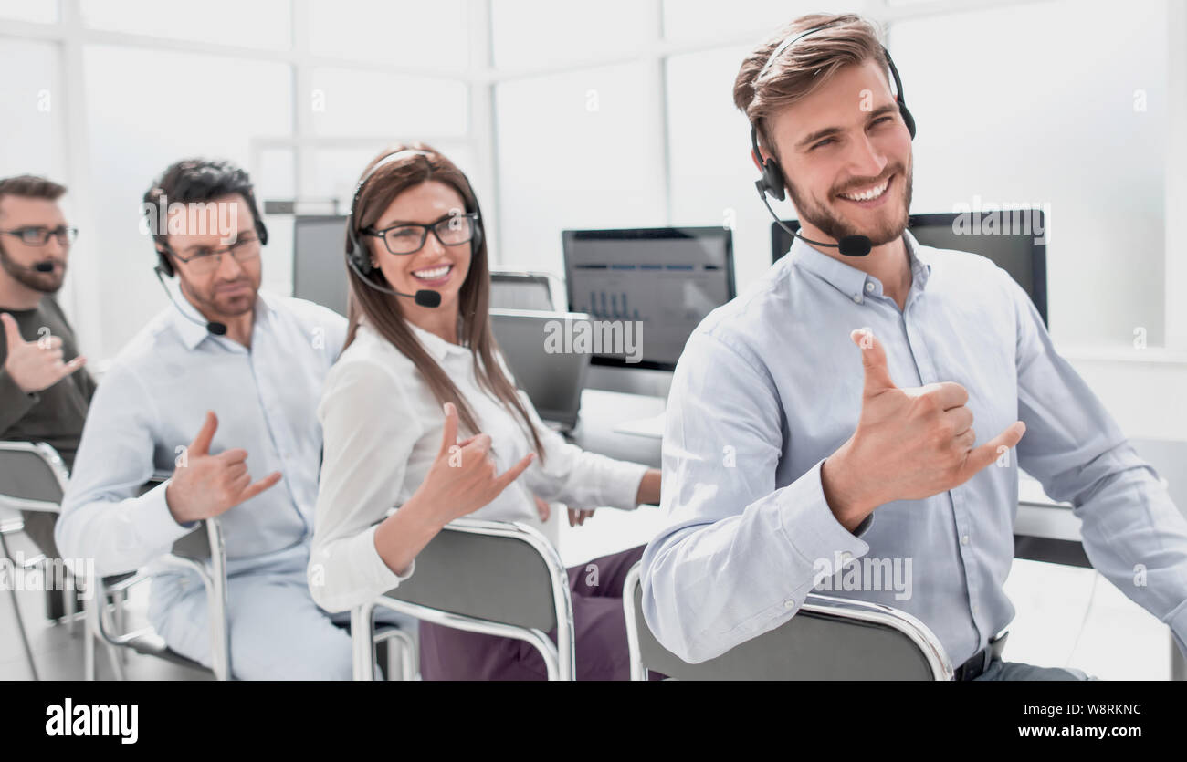 customer service operators, show a thumbs up Stock Photo - Alamy