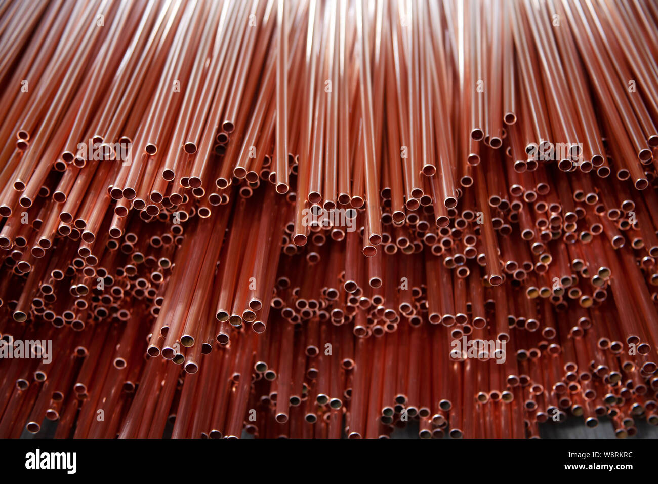Copper pipes in factory, industrial background Stock Photo - Alamy