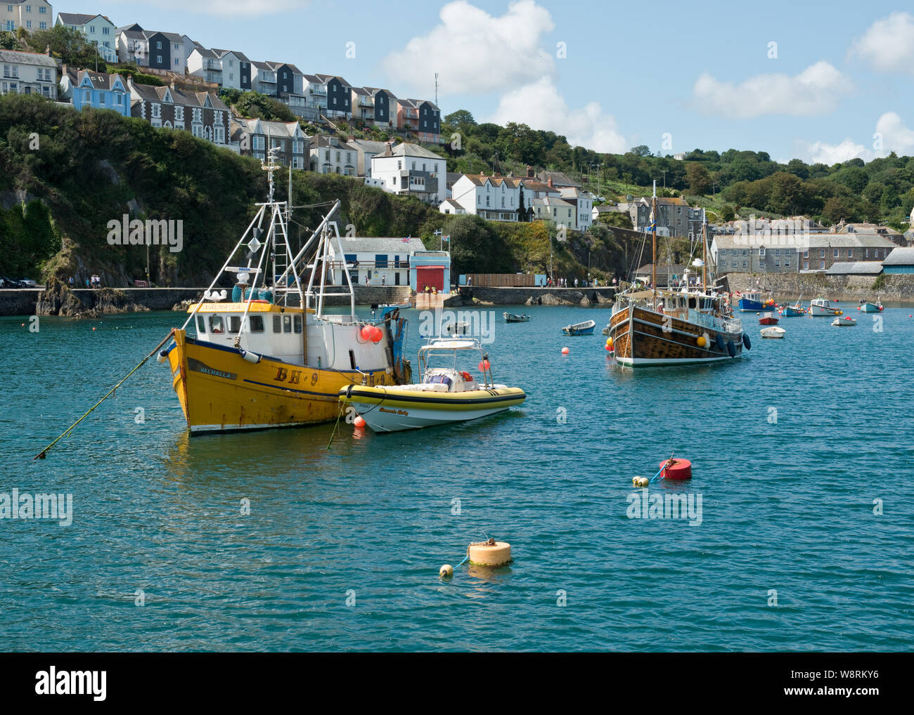 Inshore fishing boats in outer harbour. Mevagissey, Cornwall, England ...