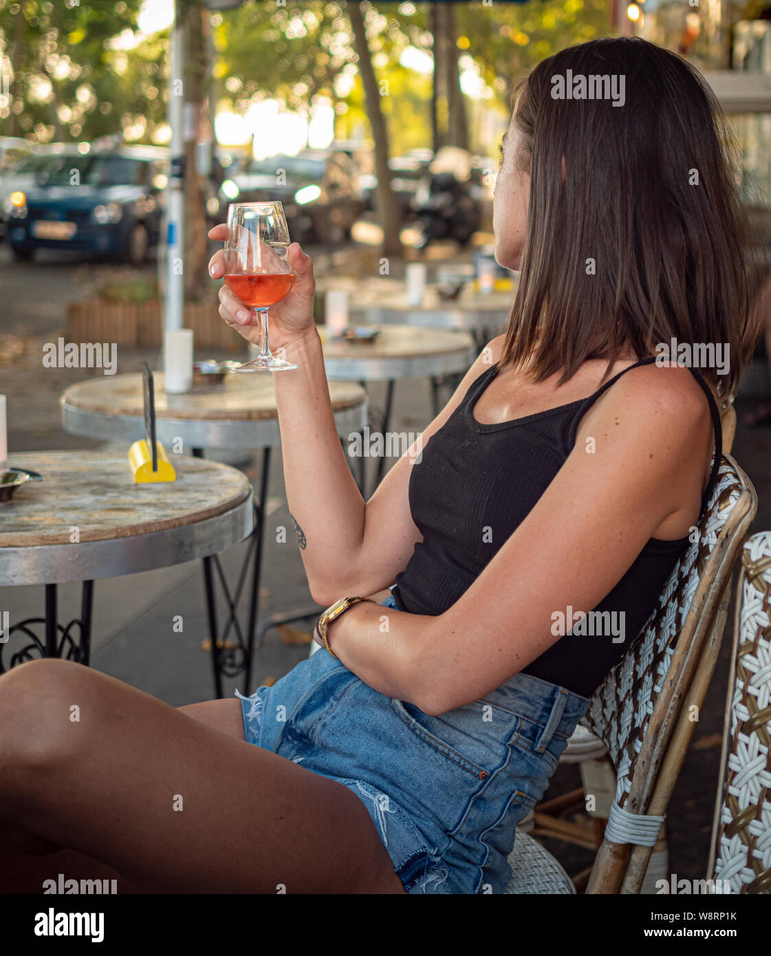 Young woman sits in a street cafe in Paris - Paris street photography ...