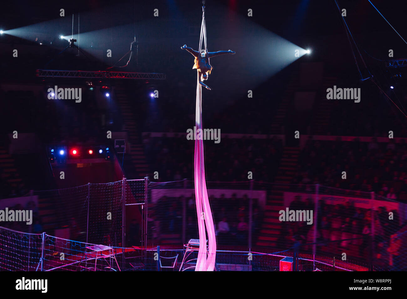 Girl's aerial acrobatics in the Circus arena Stock Photo - Alamy