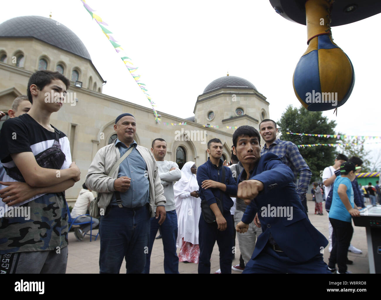 Kiev, Ukraine. 11th Aug, 2019. A man beats an impromptu punching bag ...