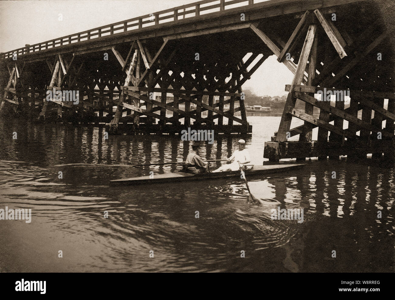 [ 1920s Japan - Japanese Canoeing Under a Wooden Bridge ] — Two men in ...