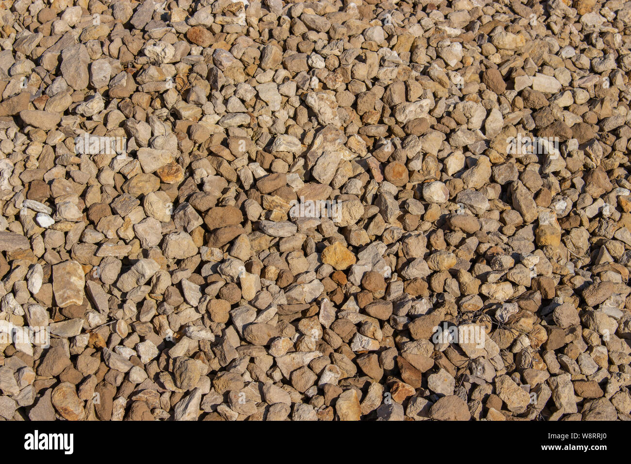 Yellow cobblestone gravel stones boulders pebbles texture background ...