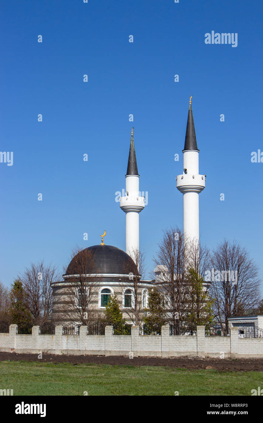 Muslim mosque shrine, a white mosque with a friend of the minarets in ...
