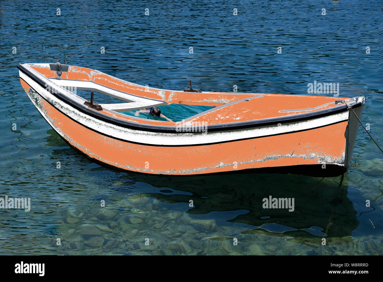 Close-up of an ailing rowing boat, diving person inside Stock Photo - Alamy
