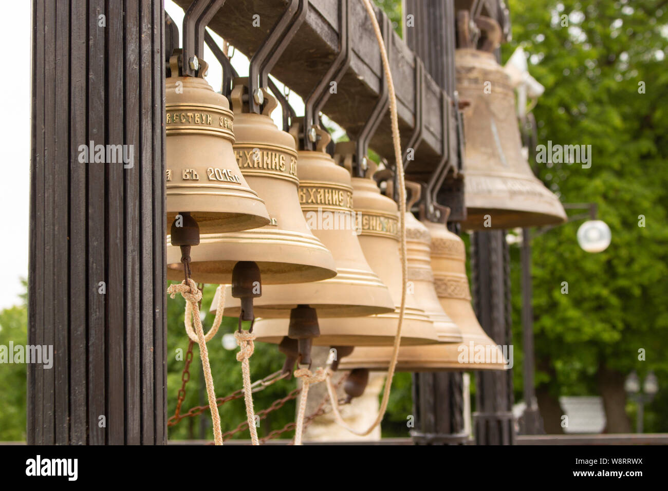 Copper brass metal church bells near the temple. Instrument ringer ...