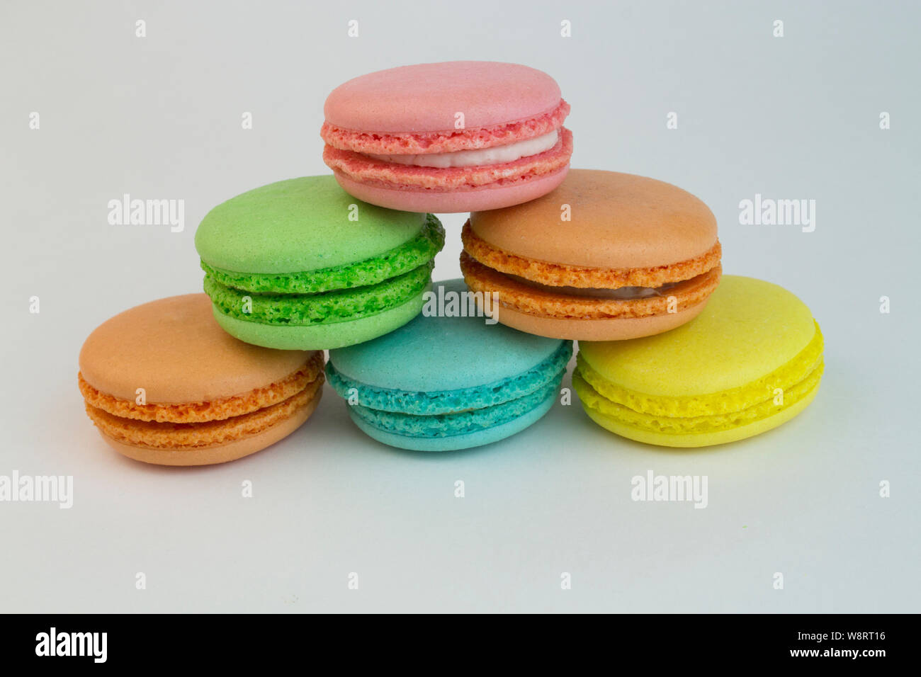 Colorful macaroni cakes on white background. Sweets many colors pink ...