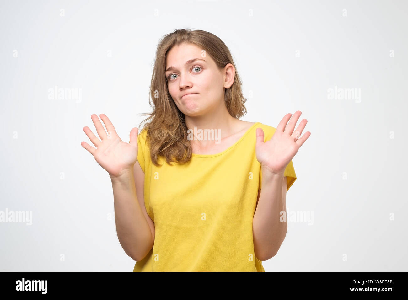 Caucasian girl showing refusal sign with both palms, having mad ...