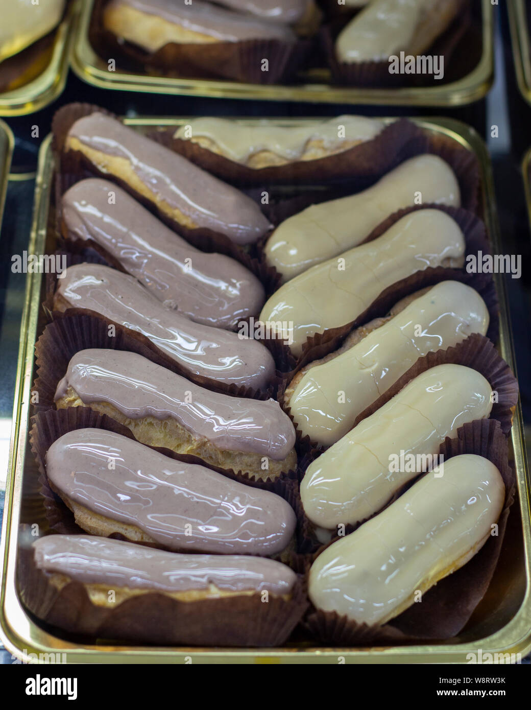 Eclair cake in a pastry shop window. A few french pastries eclair ...