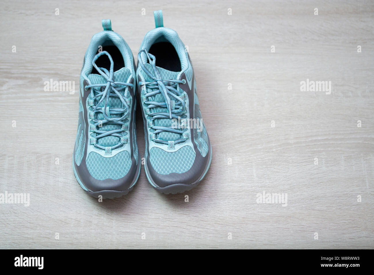 Running light blue shoes hi-res stock photography and images - Alamy