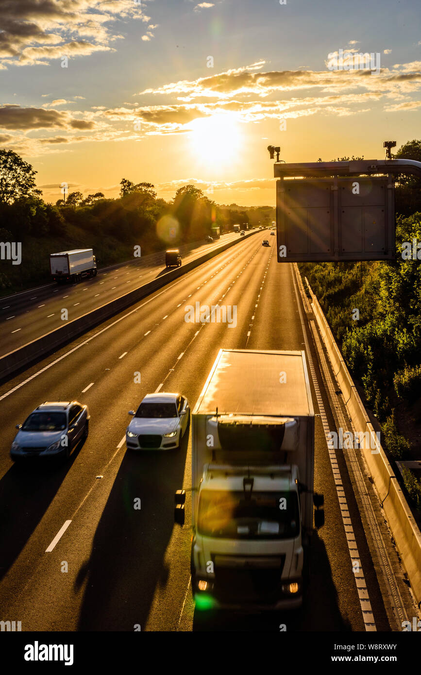 busy traffic on uk motorway road overhead view at sunset Stock Photo ...