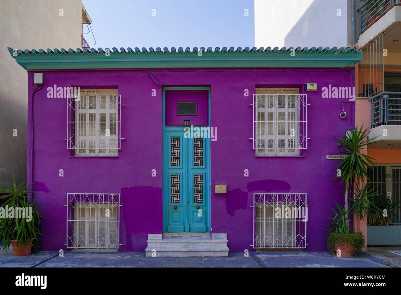 Purple architecture. A renovated neoclassic style house painted with a ...