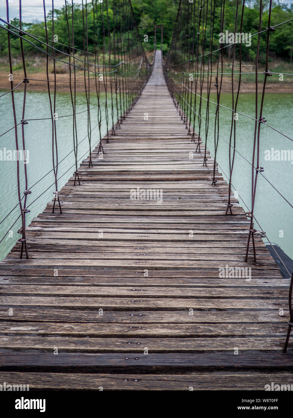 Wooden bridge across the river, Suspension bridge Stock Photo - Alamy