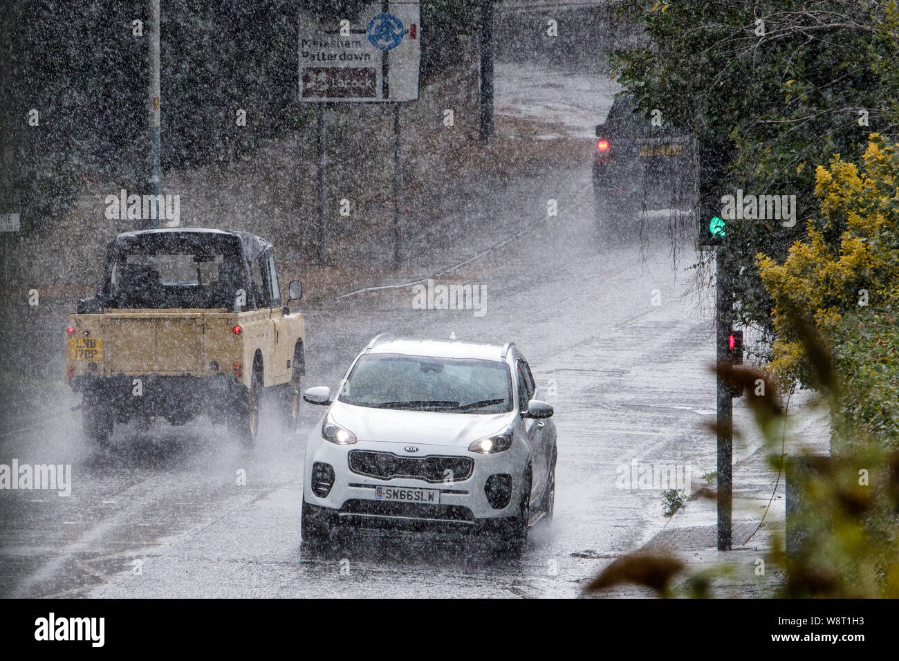 Chippenham, Wiltshire, UK. 11th August, 2019. Car drivers are pictured ...