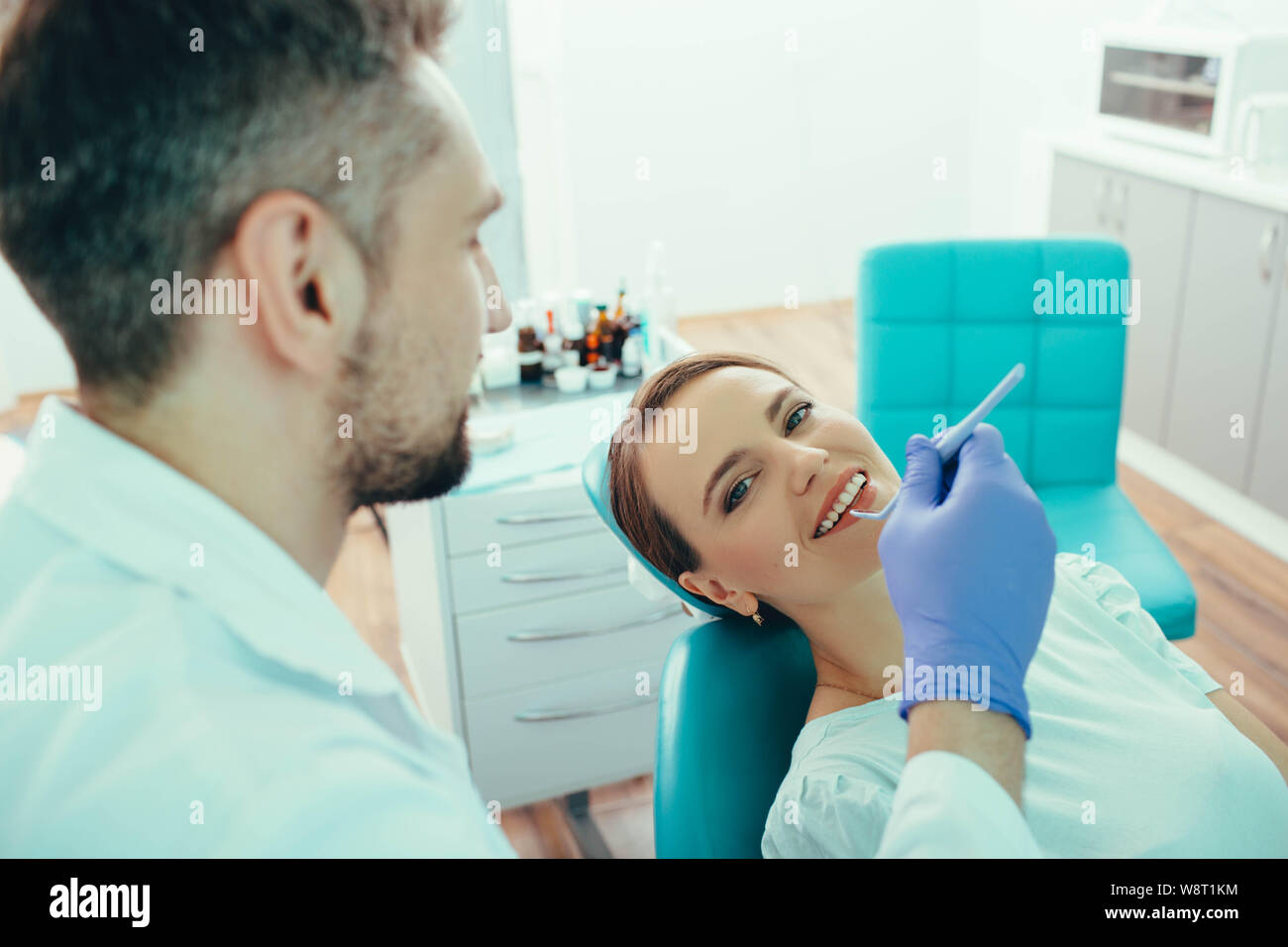 Woman getting teeth exam with her dentist at dental clinic Stock Photo ...