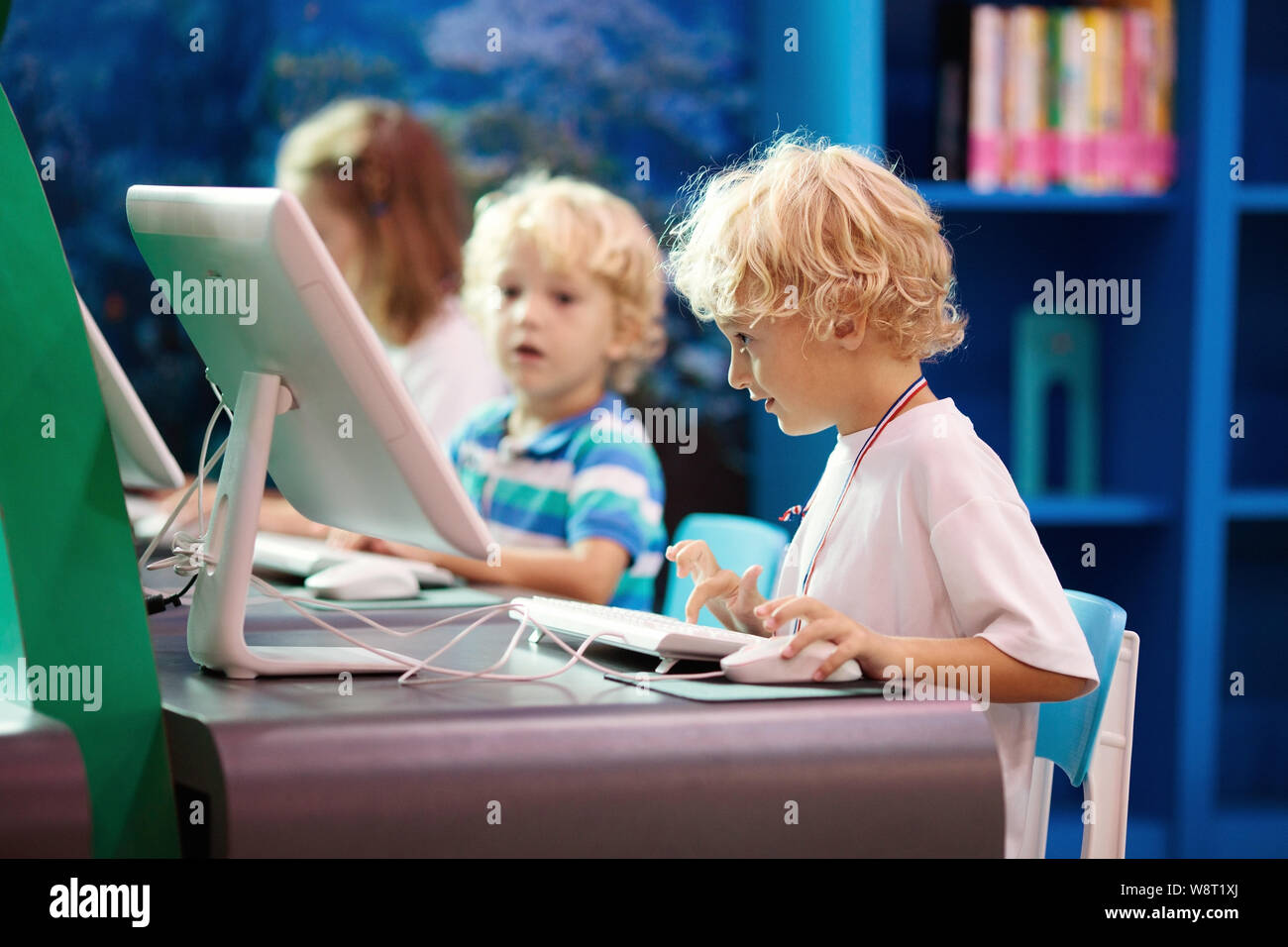Kids with computer. Children learning and studying information and ...