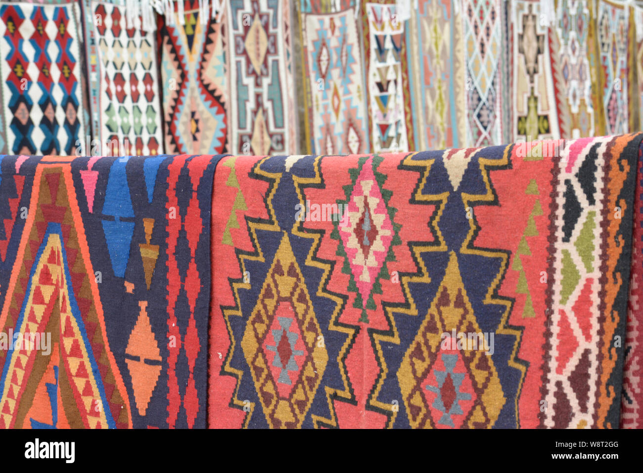 Colorful oriental Iranian rug or kilim with traditional folk geometric ...