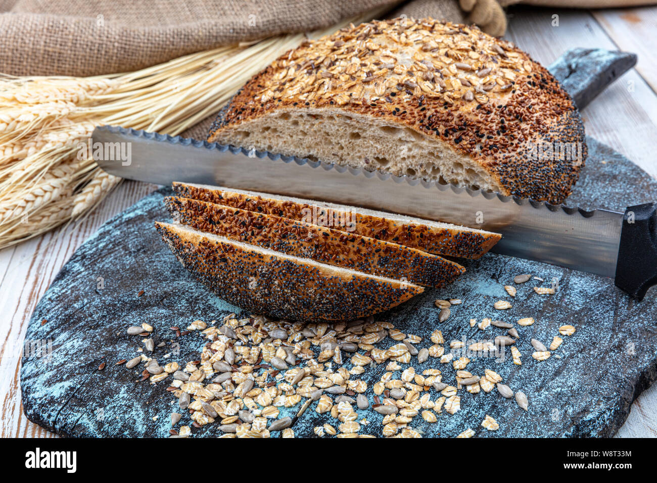 Fresh homemade bread. French bread. Bread slice and cutting knife on ...
