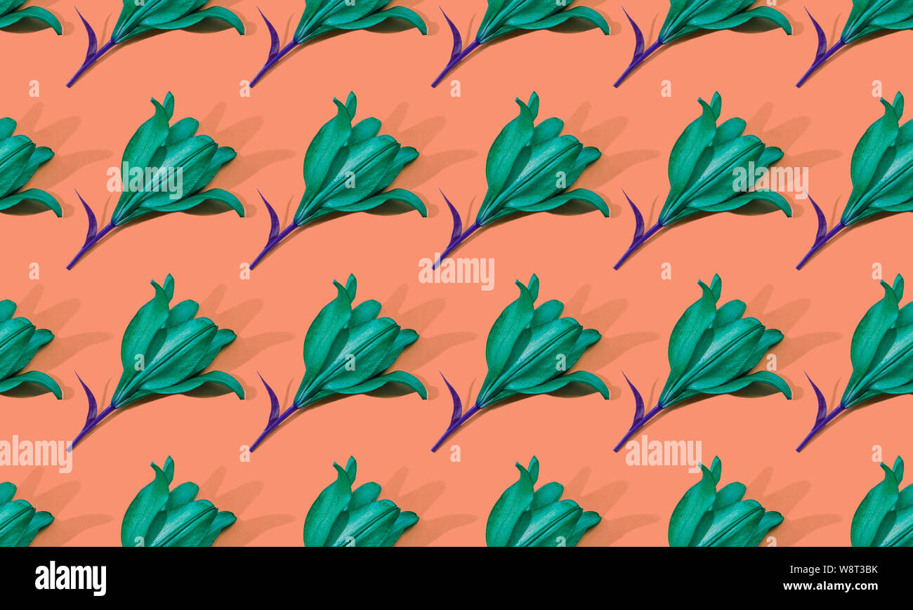 Seamless pattern of green lilies on orange background trend flat lay ...