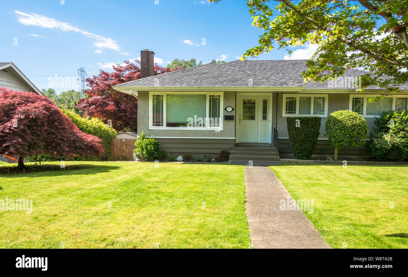 Average North American residential house with concrete pathway over ...