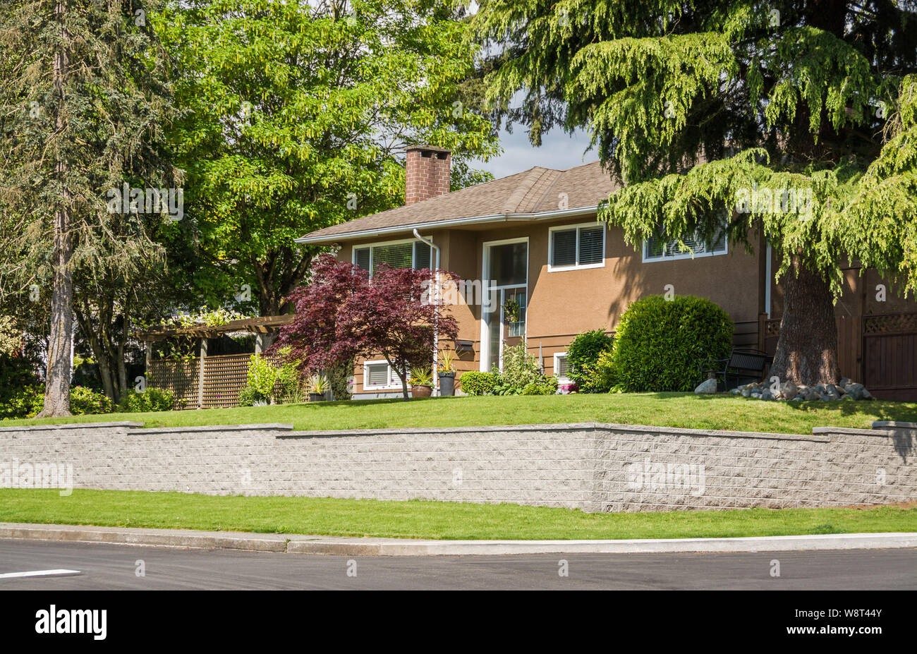 Traditional family house on elevated land terrace Stock Photo - Alamy