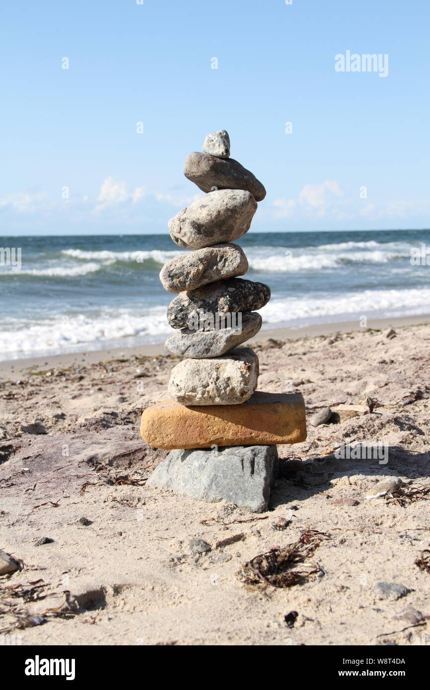 Stone pyramid on the beach Stock Photo - Alamy