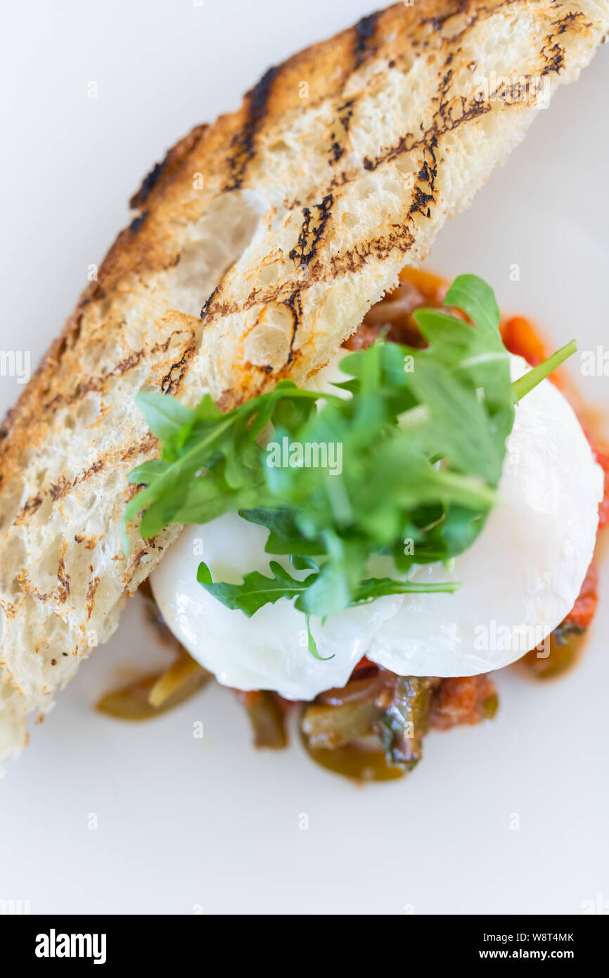 A beautiful, well presented food course on a white table Stock Photo ...