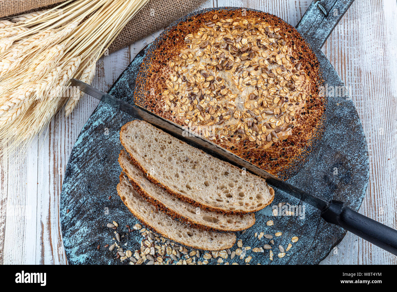 Fresh homemade bread. French bread. Bread slice and cutting knife on ...