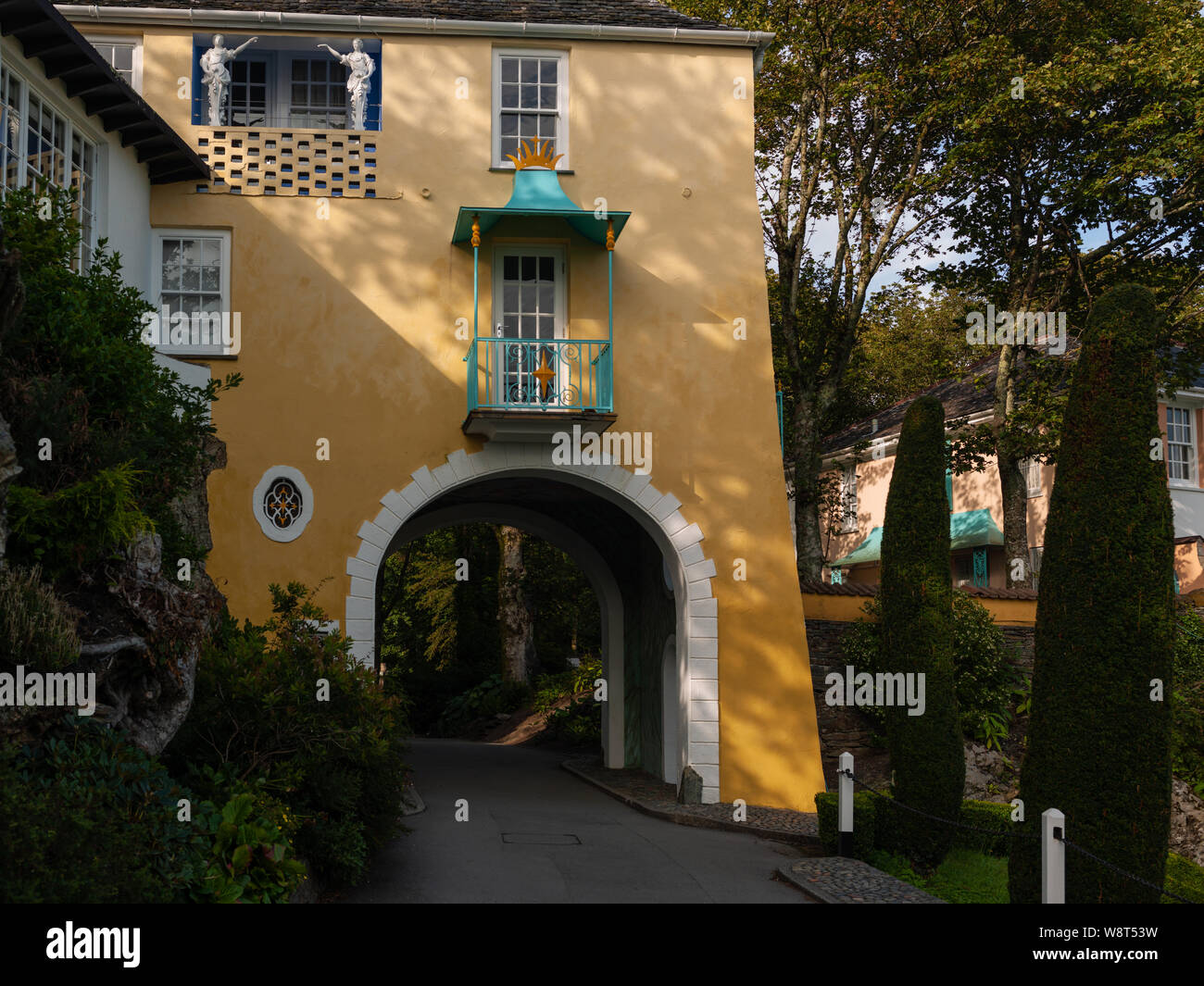 Yellow arch or entrance to Portmeirion village- Italian style ...