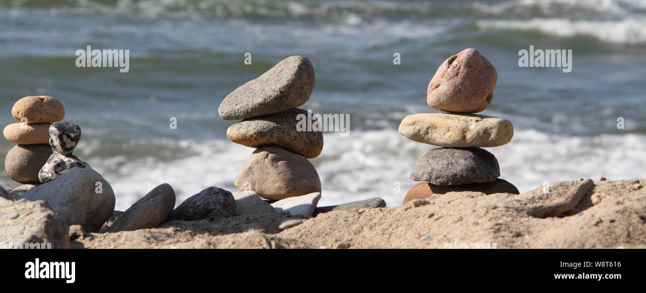 Stone pyramid on the beach Stock Photo - Alamy