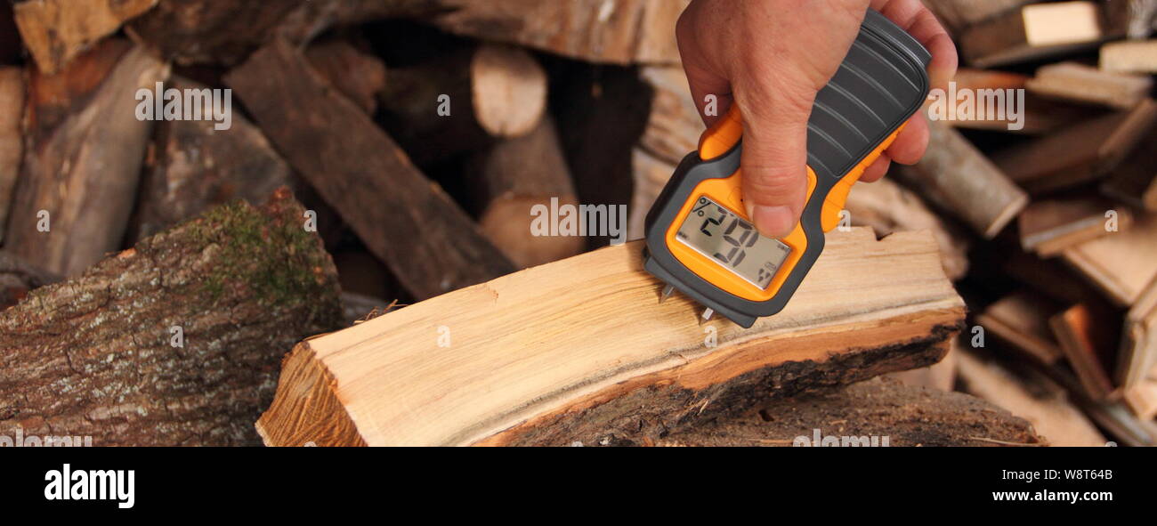 Measure moisture in firewood Stock Photo - Alamy