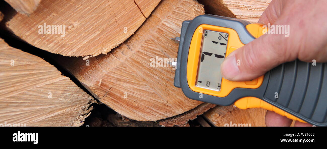 Measure moisture in firewood Stock Photo - Alamy