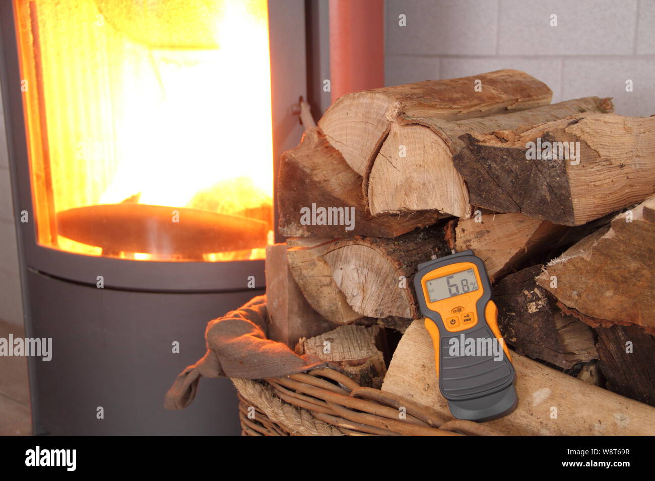 Measure moisture in firewood Stock Photo - Alamy