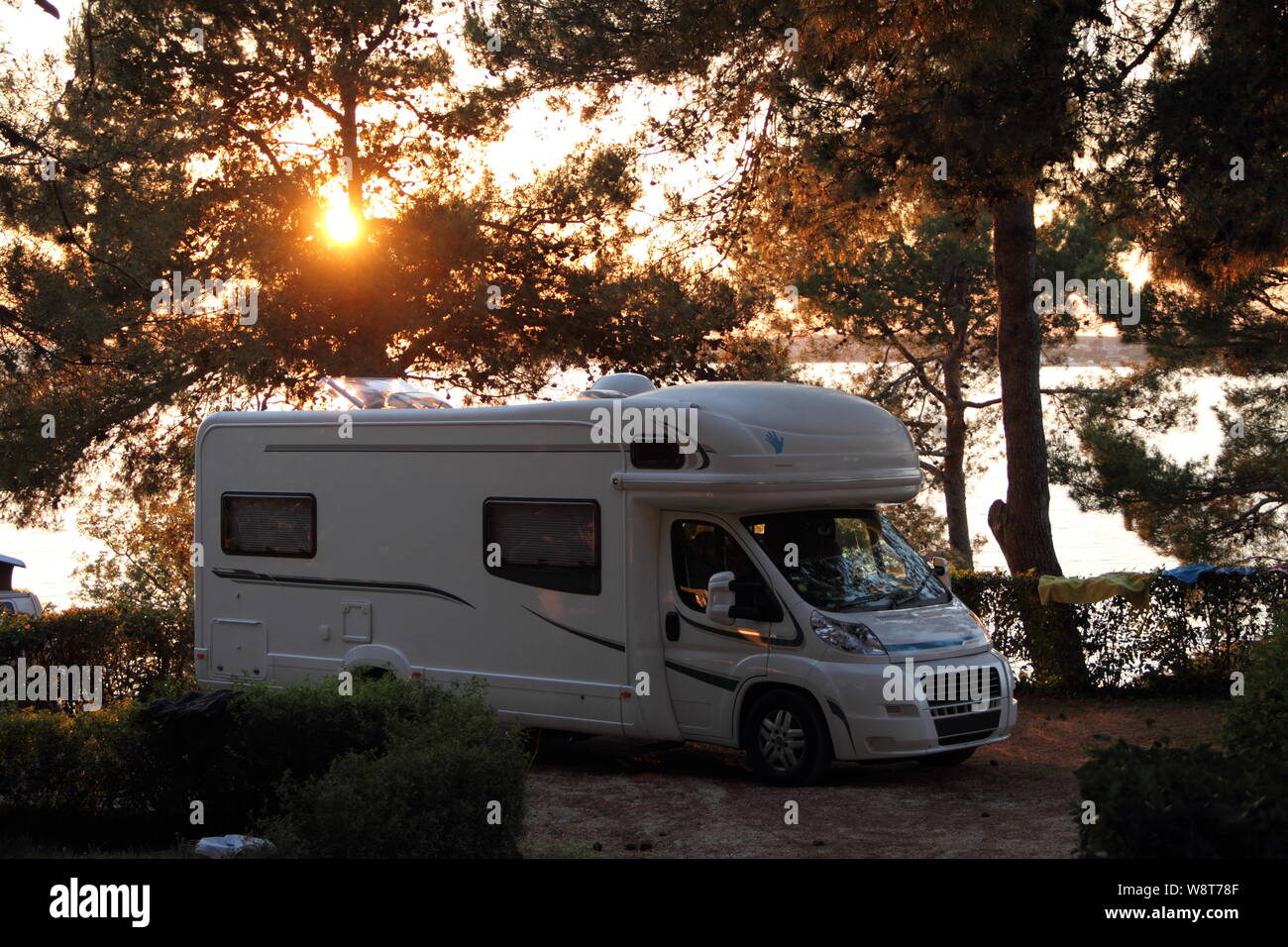 Caravan in the sunset Stock Photo - Alamy