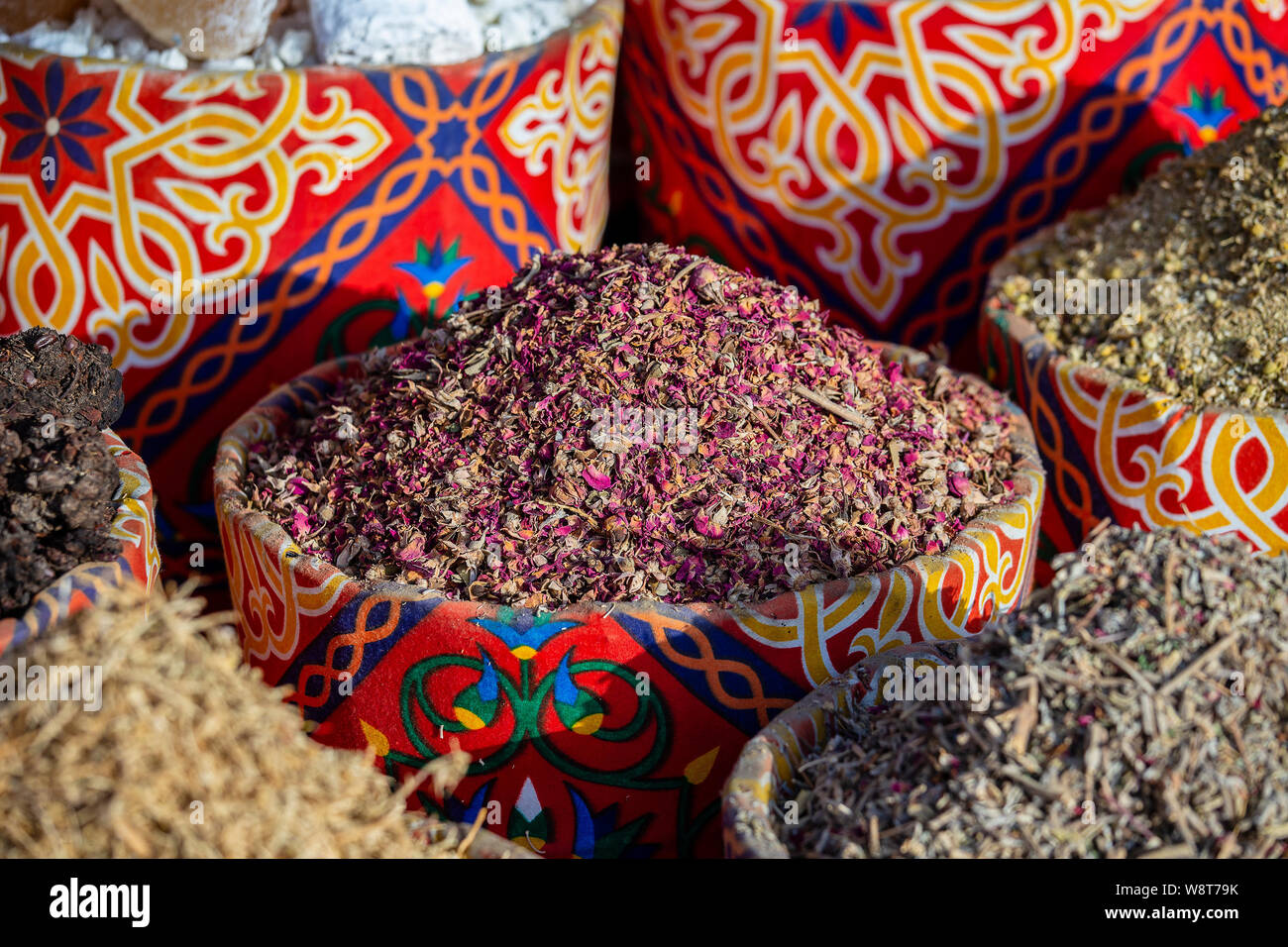 Dry karkade tea leaves in the wicker basket on the street market. Sharm ...