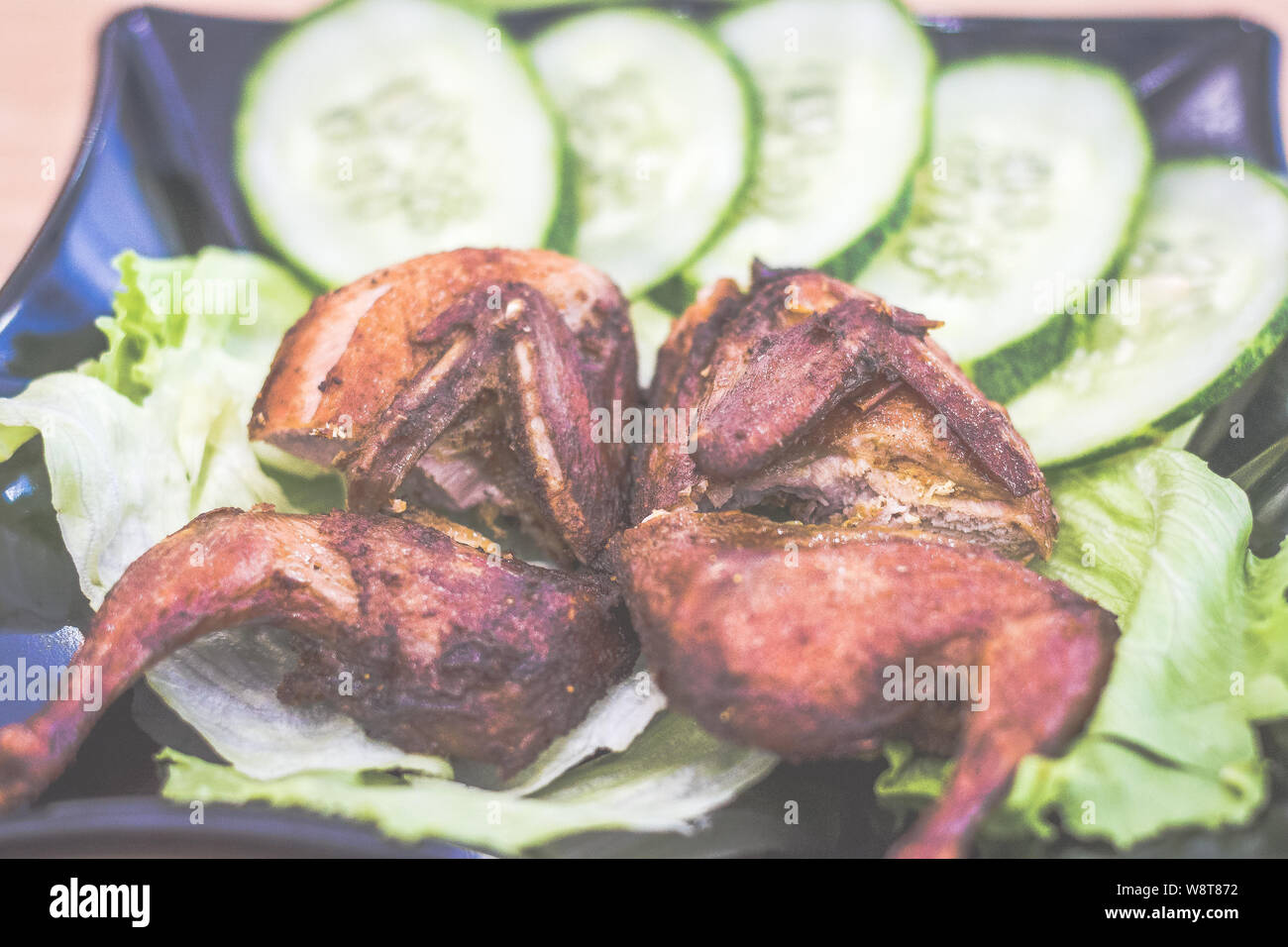 Vietnamese Fried Quail with Green Sauce and served on a bed of lettuce ...