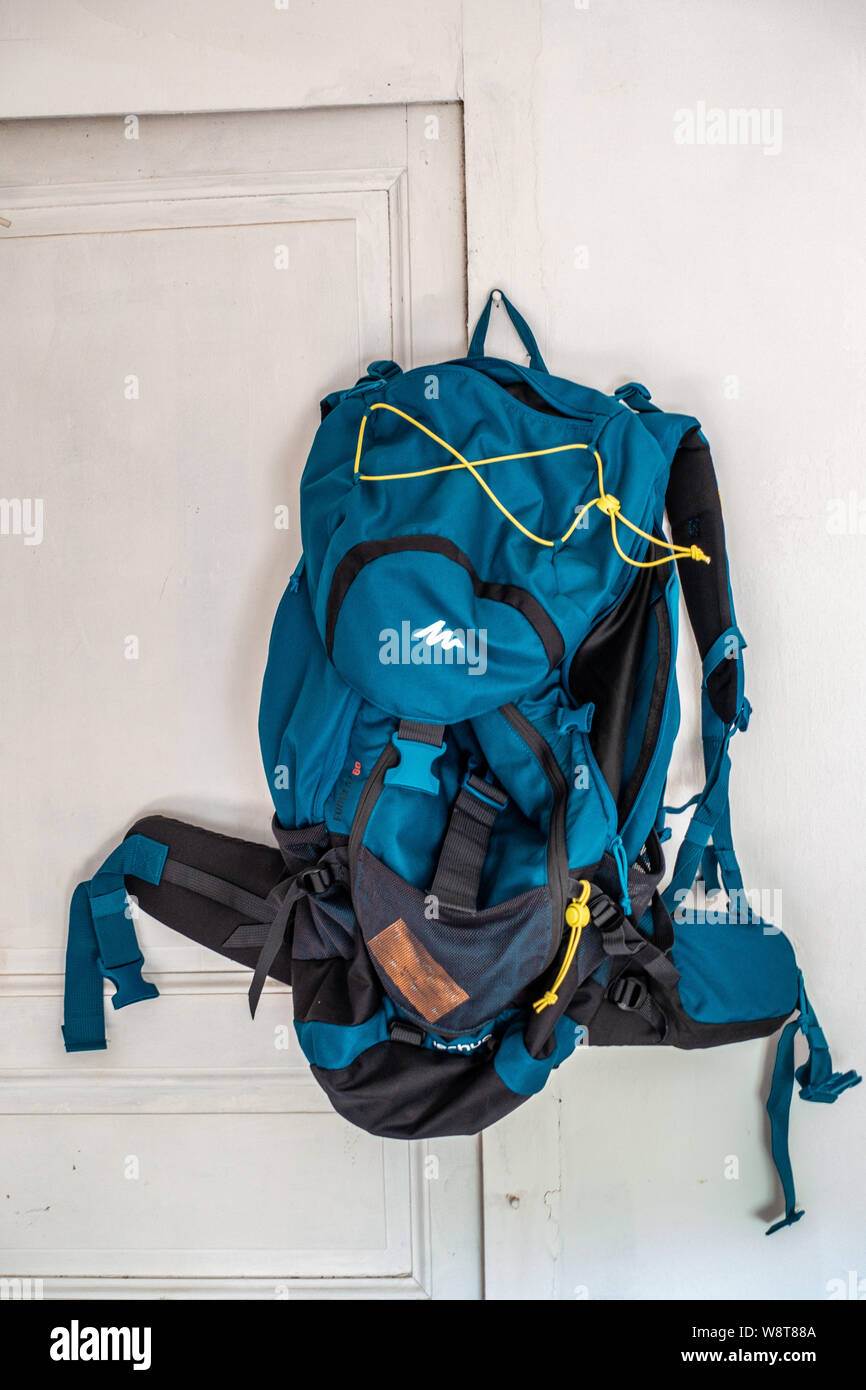 Students rucksack hanging on a door Stock Photo - Alamy
