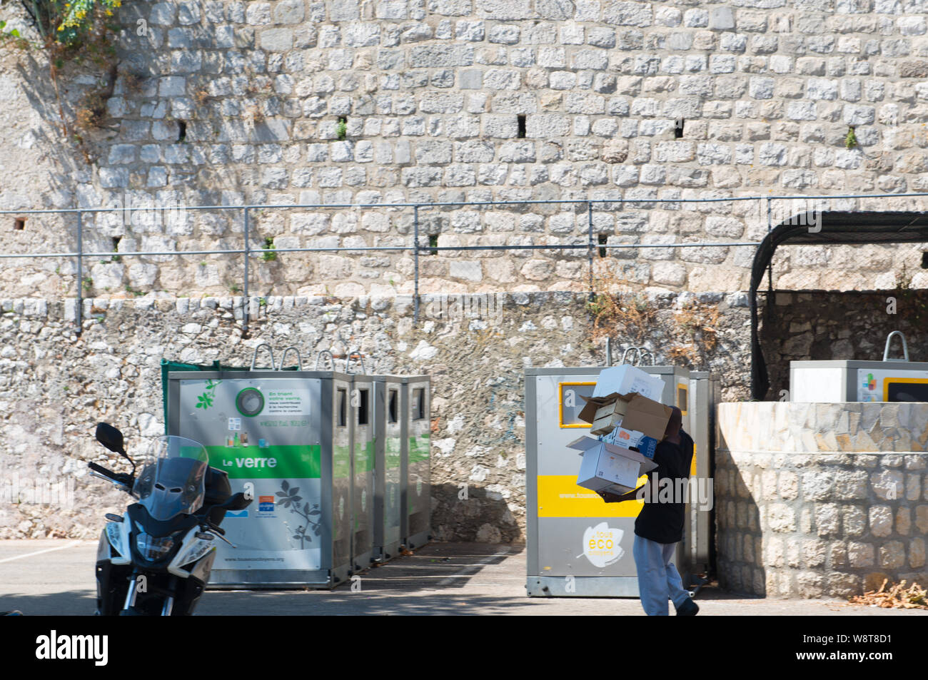 Villefranche-France,, 2019-08-03, Chef walking towards recycle bins ...