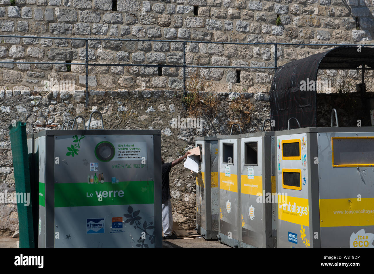 Villefranche-France,, 2019-08-03, Chef walking towards recycle bins ...